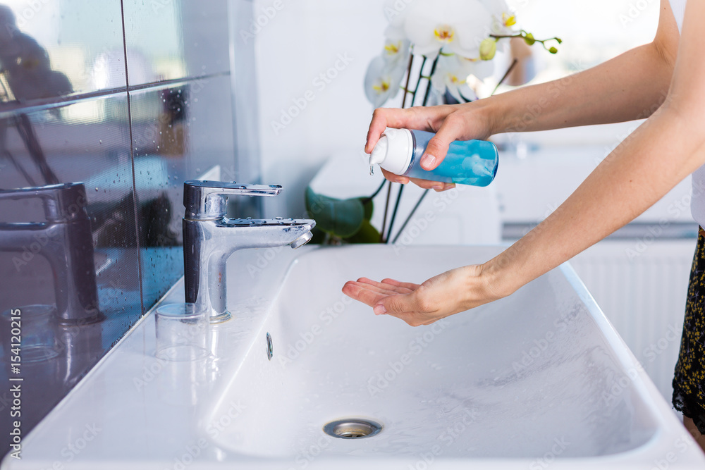 Woman washing up in the morning Stock Photo | Adobe Stock