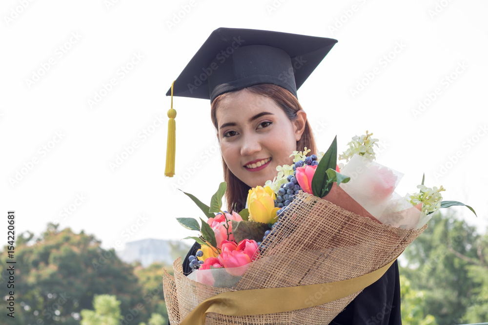 happy graduate flower bouquet in hand with in the garden Stock Photo ...