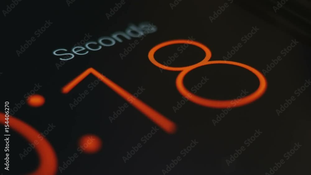 Orange thin number fonts countdown close up in black background ...