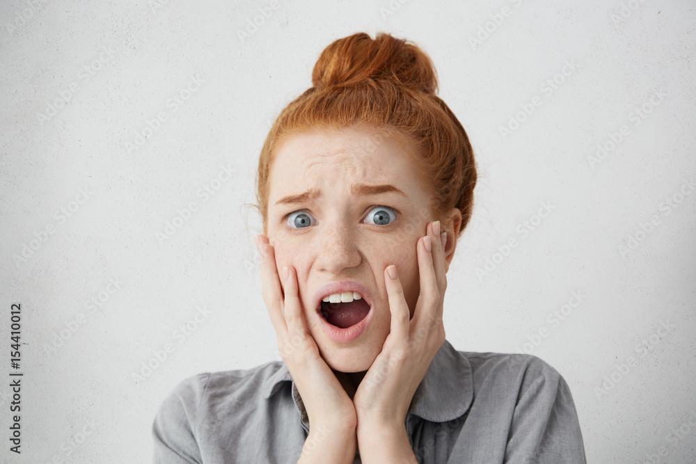 That's terrible! Headshot of scared shocked European teenage girl with ...