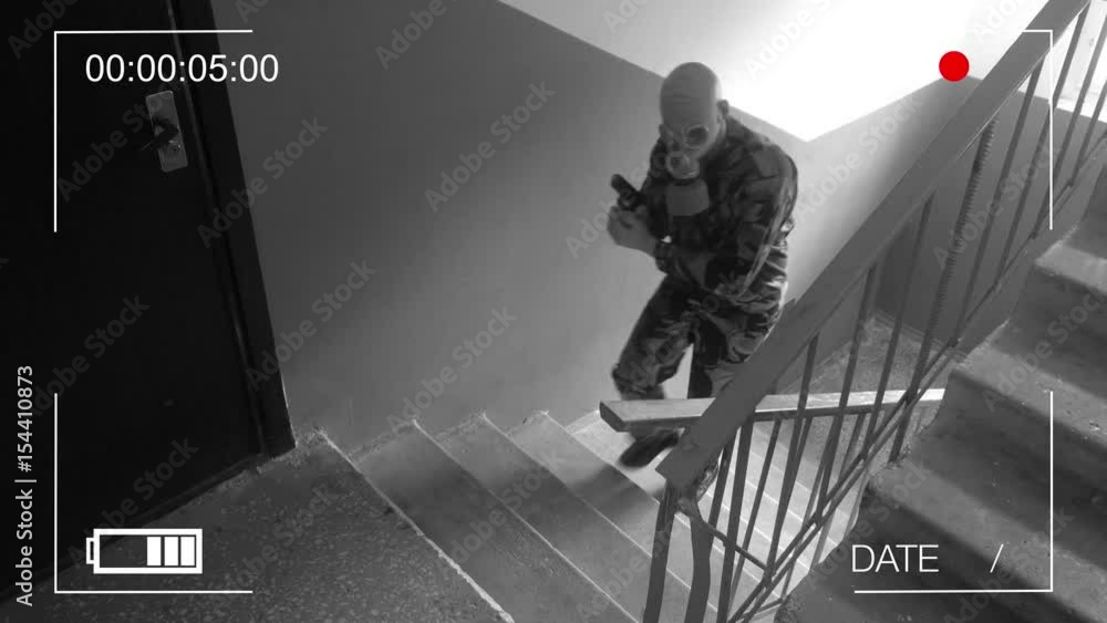 Guard dressed in military uniform in a gas mask. the storming of the ...