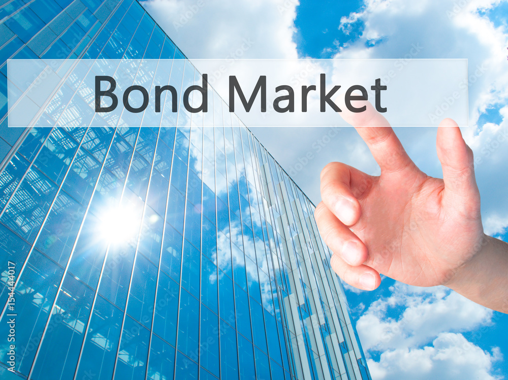 Bond Market - Hand pressing a button on blurred background concept on ...