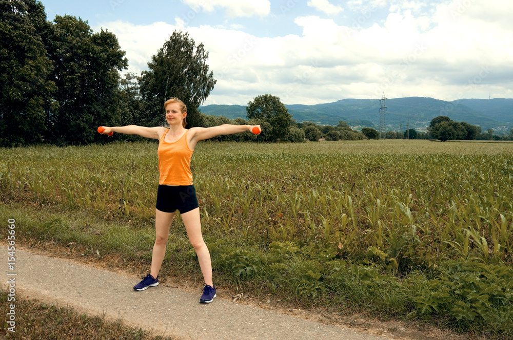 Junge Frau beim Sport Stock-Foto | Adobe Stock