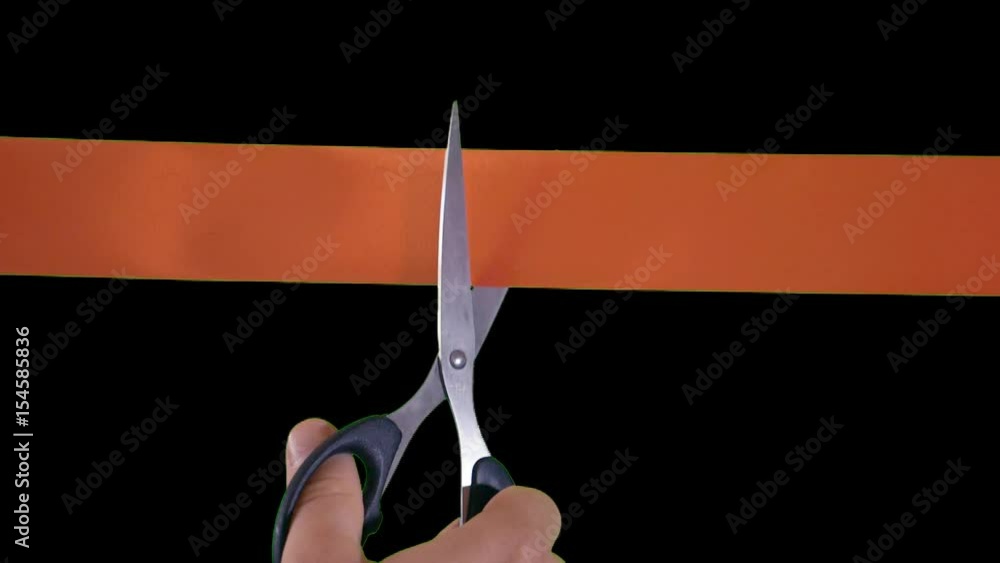 Vidéo Stock Hand cutting red ribbon over transparent background | Adobe ...