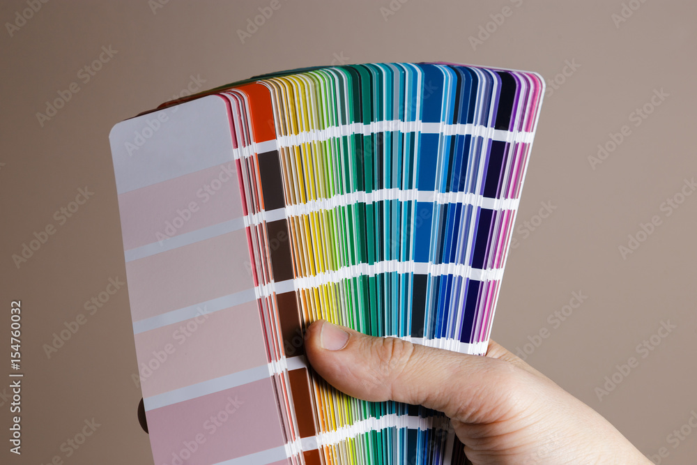 Hand holding a color palette for repair Stock Photo | Adobe Stock
