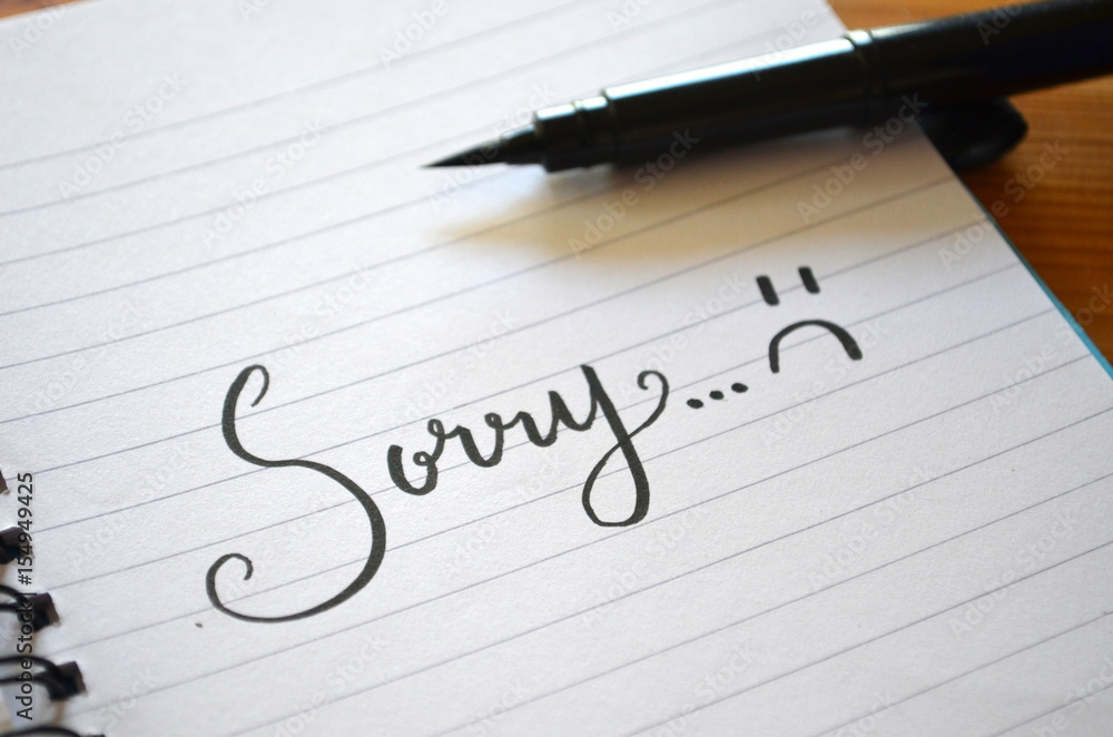 SORRY... written in notebook on desk Stock Photo | Adobe Stock
