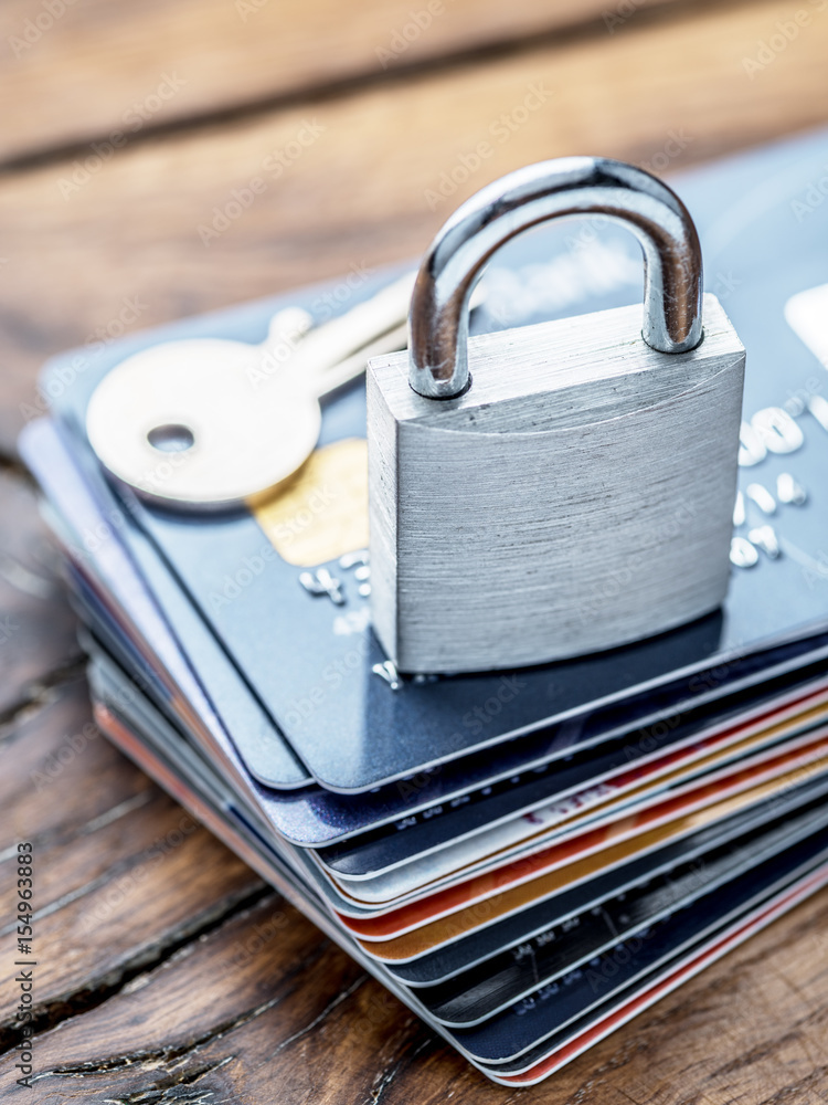 Credit cards and simle mechanical lock. Stock Photo | Adobe Stock