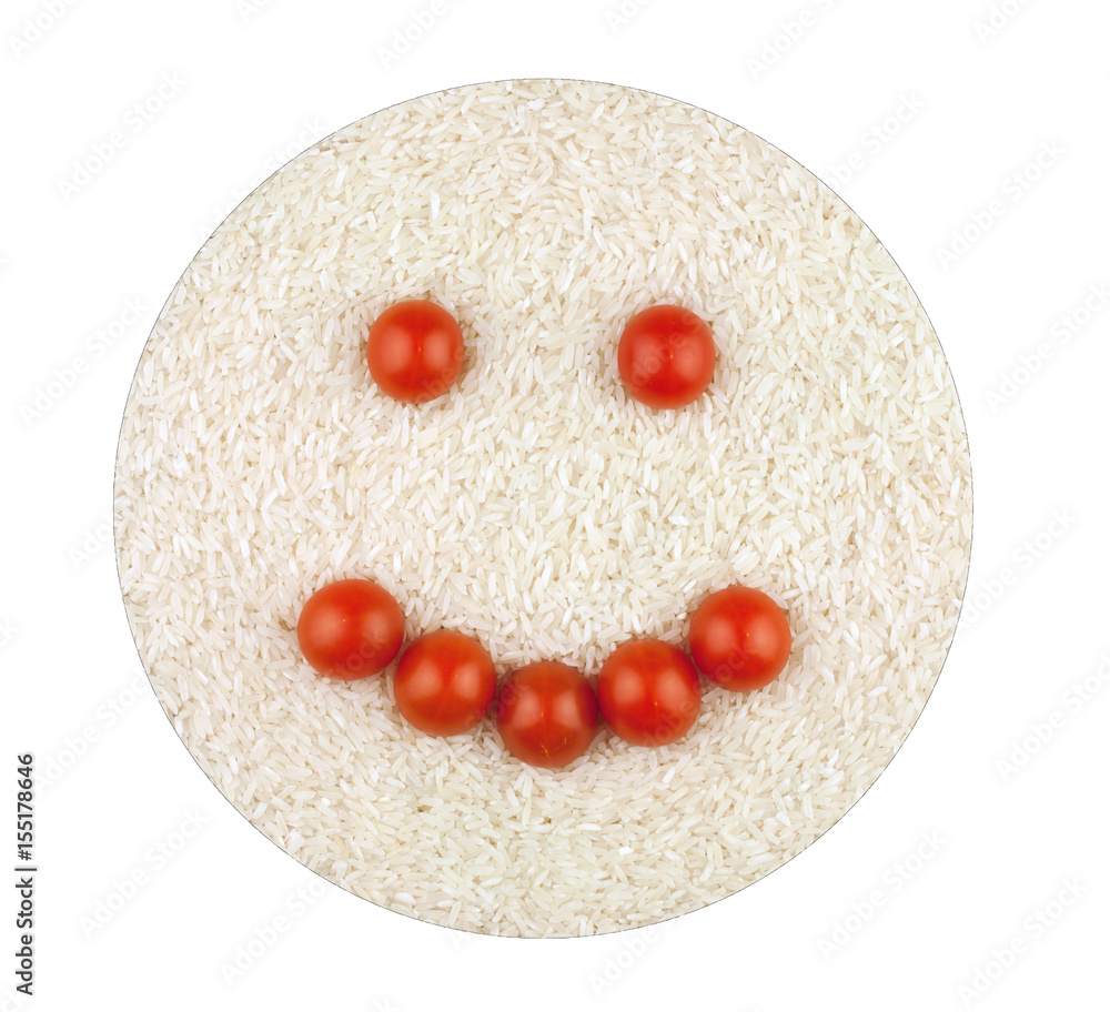 Happy smiley made from red tomatoes on the background of rice groats ...