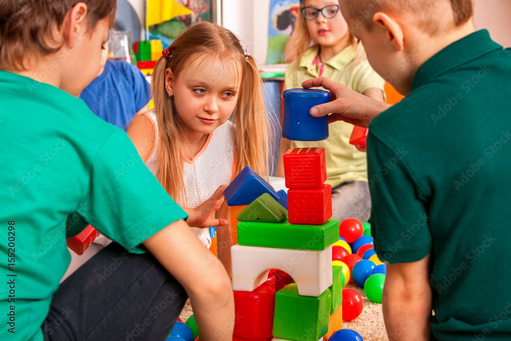 Break school of children playing in kids cubes indoor. Lesson in ...