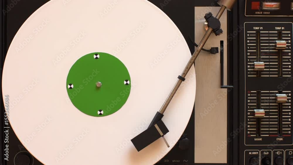 Vinyl record pleer. Plays song from an old turntable 4k top view. Black ...