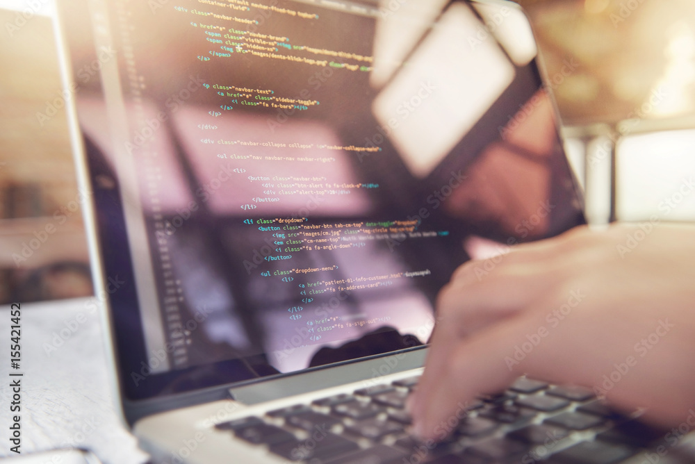 Closeup coding on screen, Woman hands coding html and programming on screen laptop, development ...