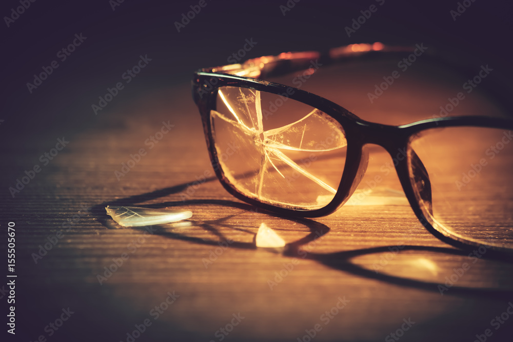 Foto de dramatic lit image of broken glasses on the floor / selective ...