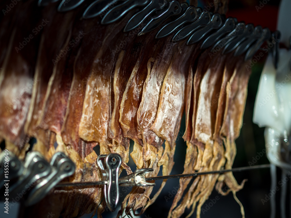 Dried squid hang on the rack, street food in Thailand foto de Stock ...