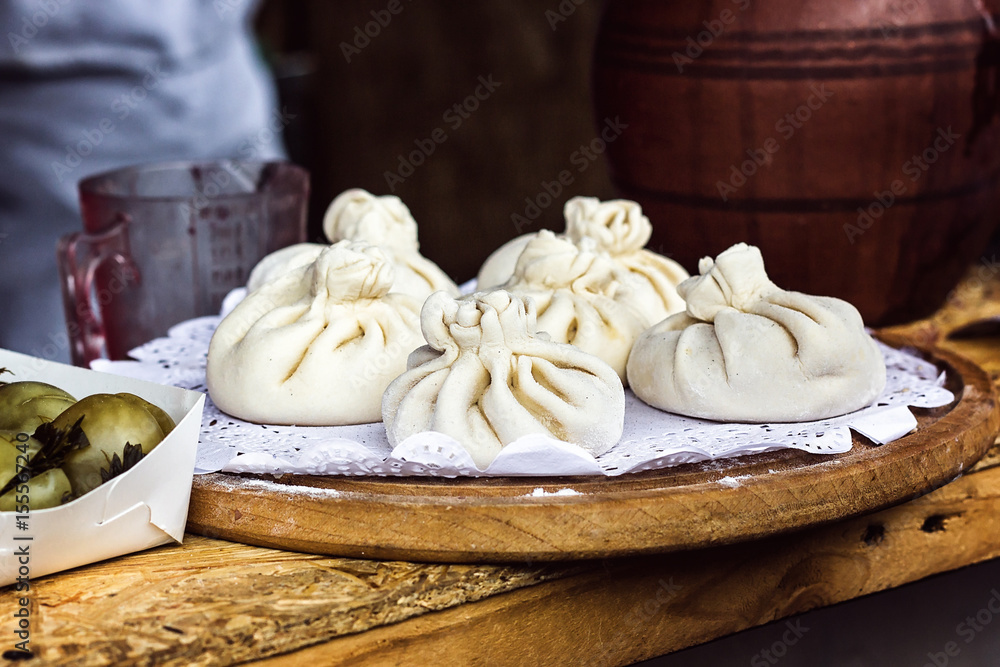 National Georgian cuisine Khinkali wooden background Cook prepares ...