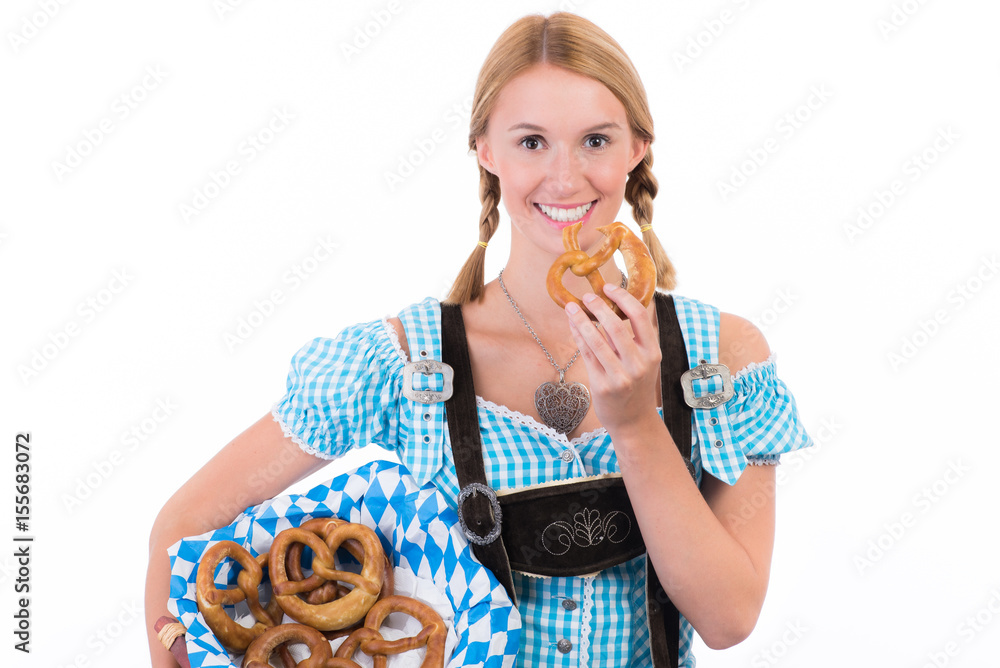 frau mit brezelkorb isst einen brezel Photos | Adobe Stock