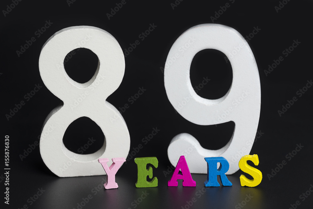 Letters and numbers eighty-nine years old on a black background. Stock ...