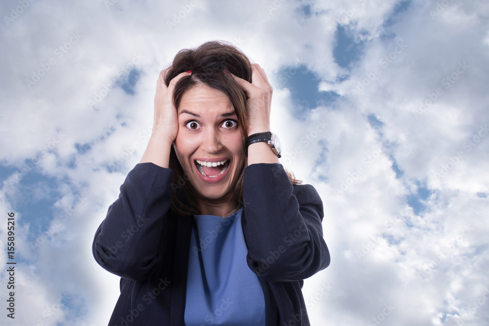 Stress. Woman stressed is going crazy pulling her hair in frustration ...