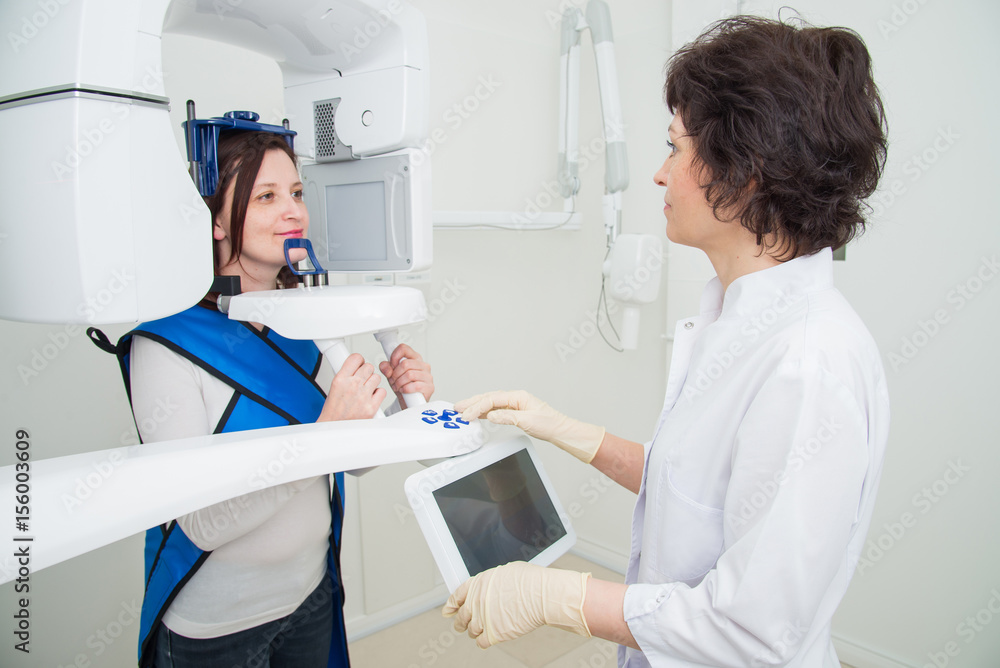 Dentist taking a panoramic digital X-ray of a patient s teeth Stock ...