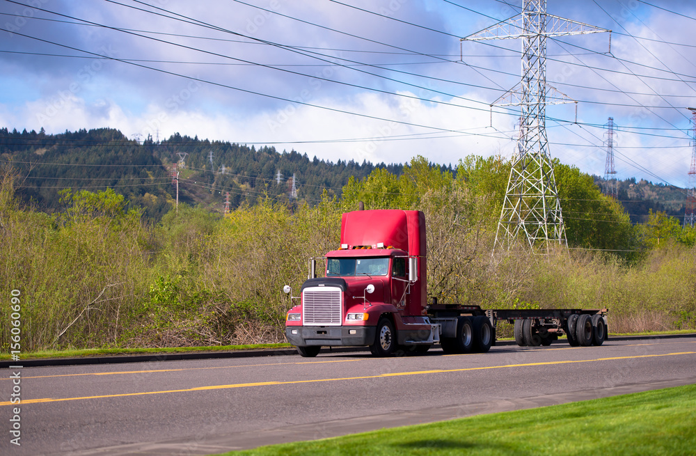 Red Big Rig on the road with power line Stock Photo | Adobe Stock