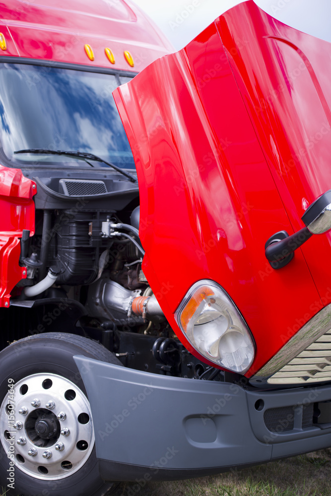 Super bright red modern semi truck engine under open hood Stock Photo ...