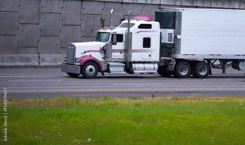 Big rig semi truck custom built with reefer trailer unit on road Stock ...