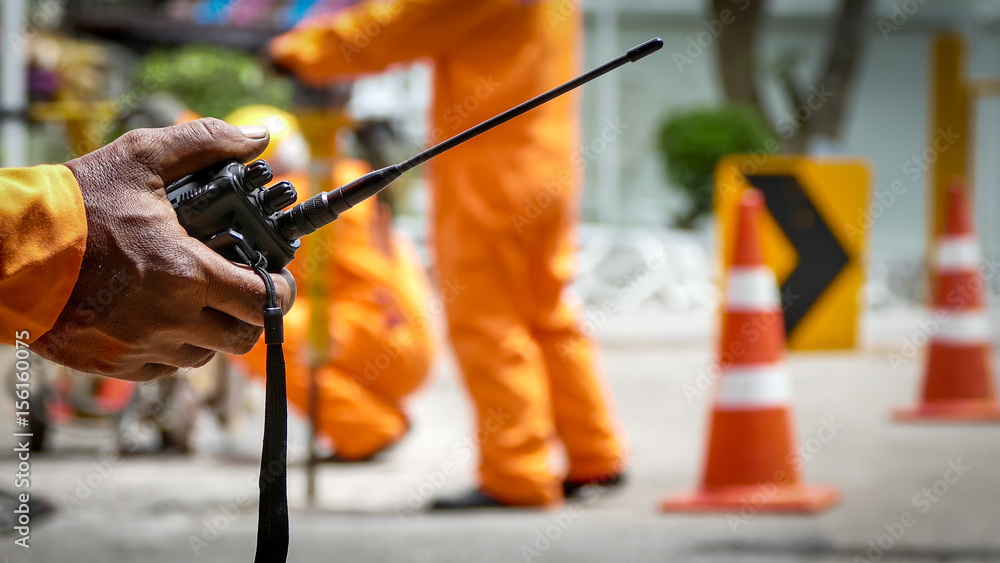 Walkie Talkie or Portable radio transceiver in Road construction work ...