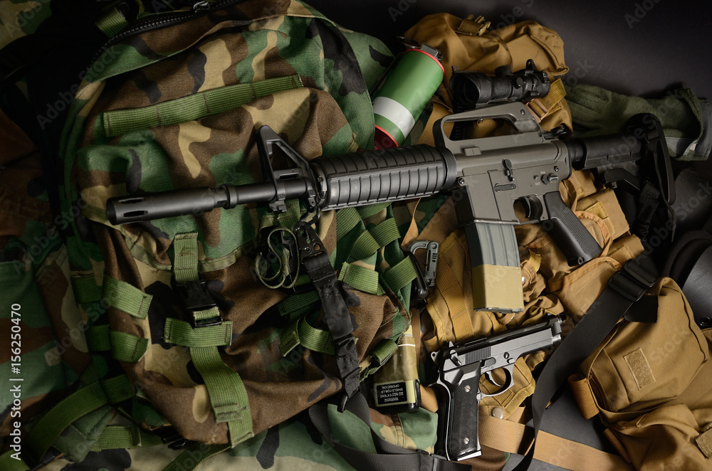 Used weapons, pistol, grenade with tactical chest rigs and ammunition ...