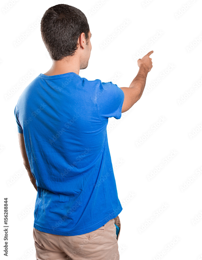 Cool young man pointing against white background Stock Photo | Adobe Stock