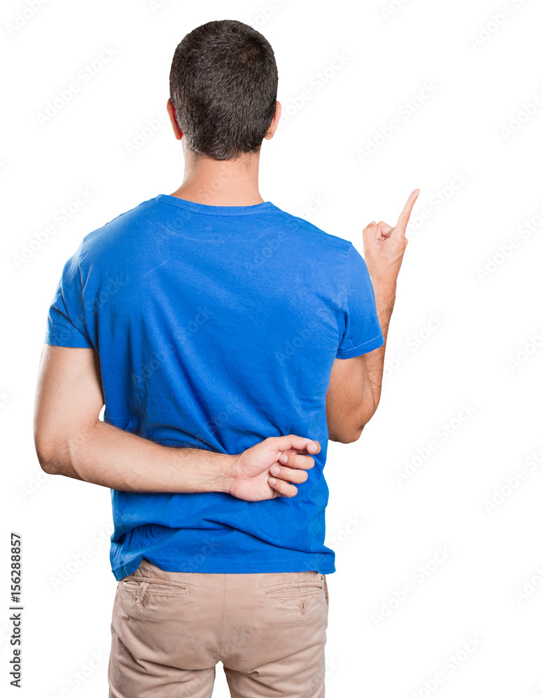 Cool young man pointing against white background Stock Photo | Adobe Stock