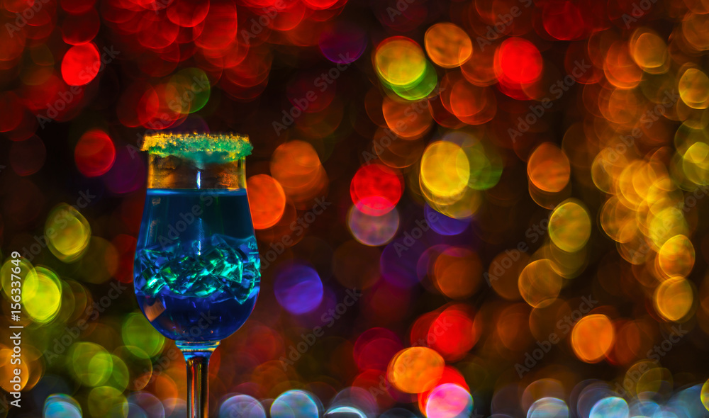 colored drink in glass, cocktail, night lights bokeh background ...