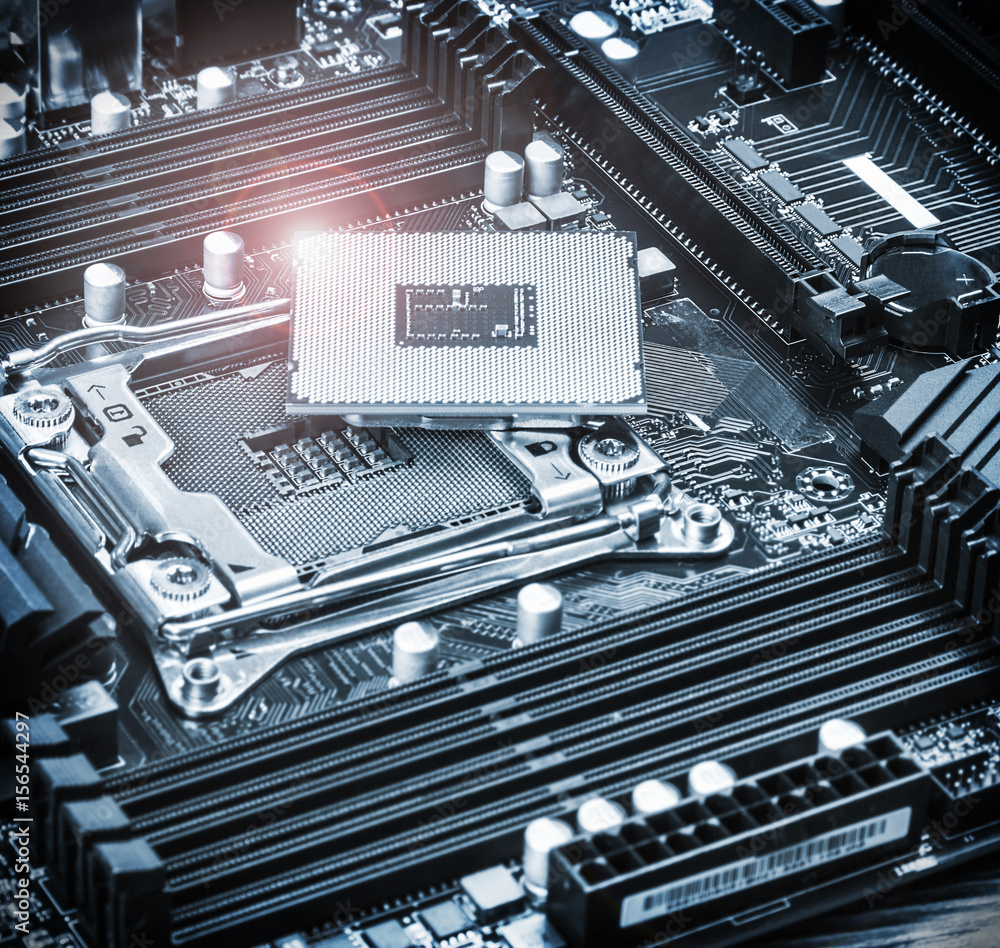 CPU socket and processor on the motherboard. Focus on the motherboard ...