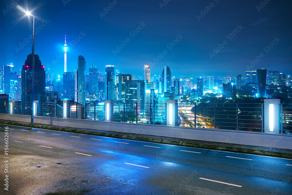 Empty side view asphalt with modern city skyline , night scene ,Kuala ...