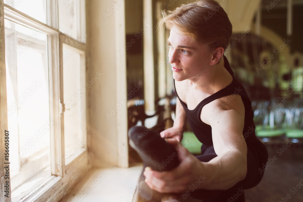 Male ballet dancer stretching at ballet barre, close-up of foot Stock ...