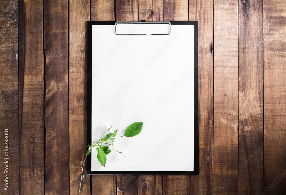 Paper clipboard on vintage wood table background. Blank letterhead and ...
