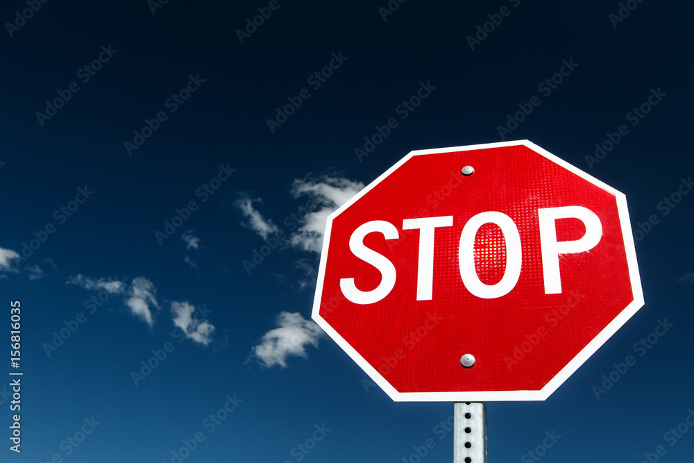 Stop sign against bright blue sky. Stock Photo | Adobe Stock