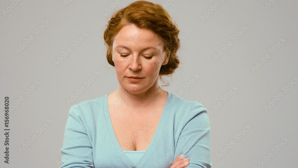 Mid aged actress showing emotions of sadness. Actress in studio shows ...