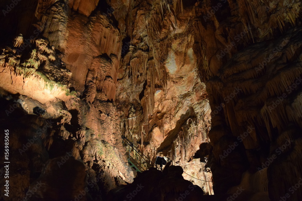 Inside view of an underground cave with stalagmites and stalactites ...