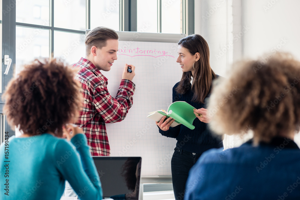 Involved students sharing ideas and opinions while brainstorming during ...