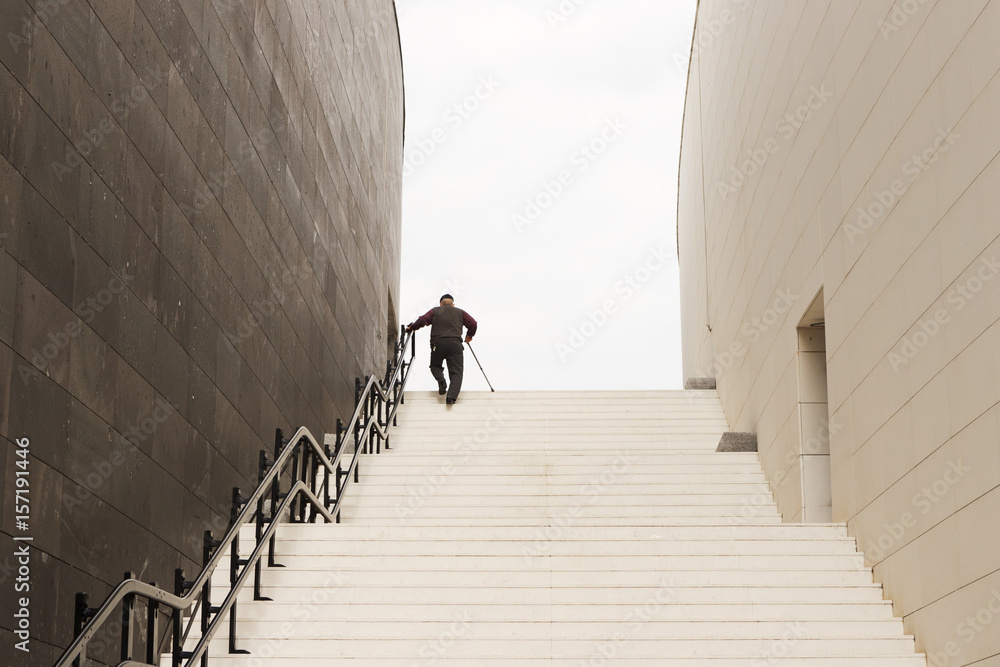 Old man climbing up the stairs with his walking stick Stock Photo ...