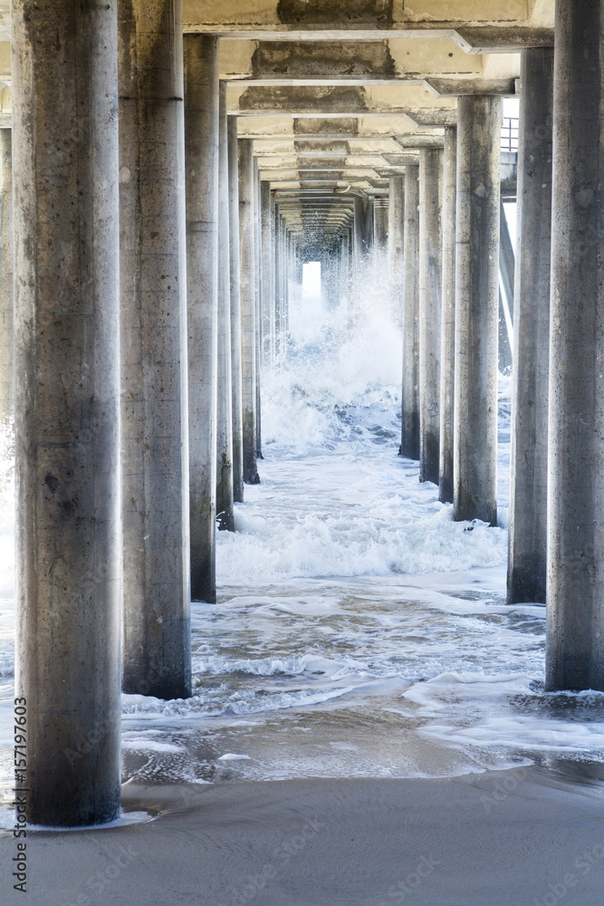 Rough water at beach under pier Stock Photo | Adobe Stock