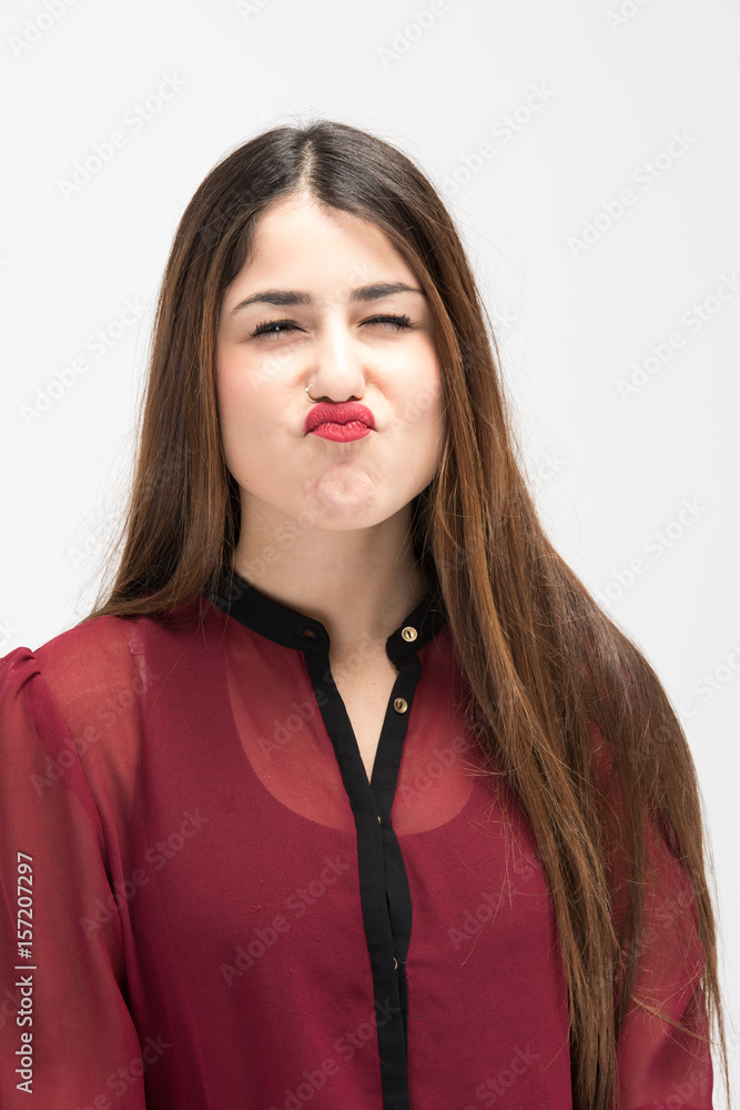 Young girl with duck face gesture with red lipstick and transparent ...