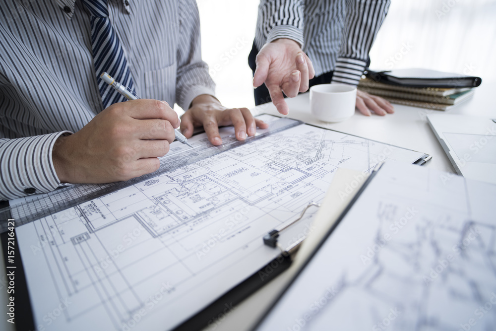 Men draw drawings using rulers Stock Photo | Adobe Stock