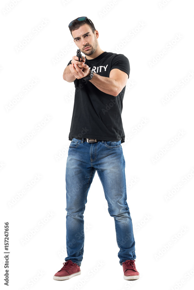 Plain clothes undercover cop aiming gun with both hands at viewer. Full ...