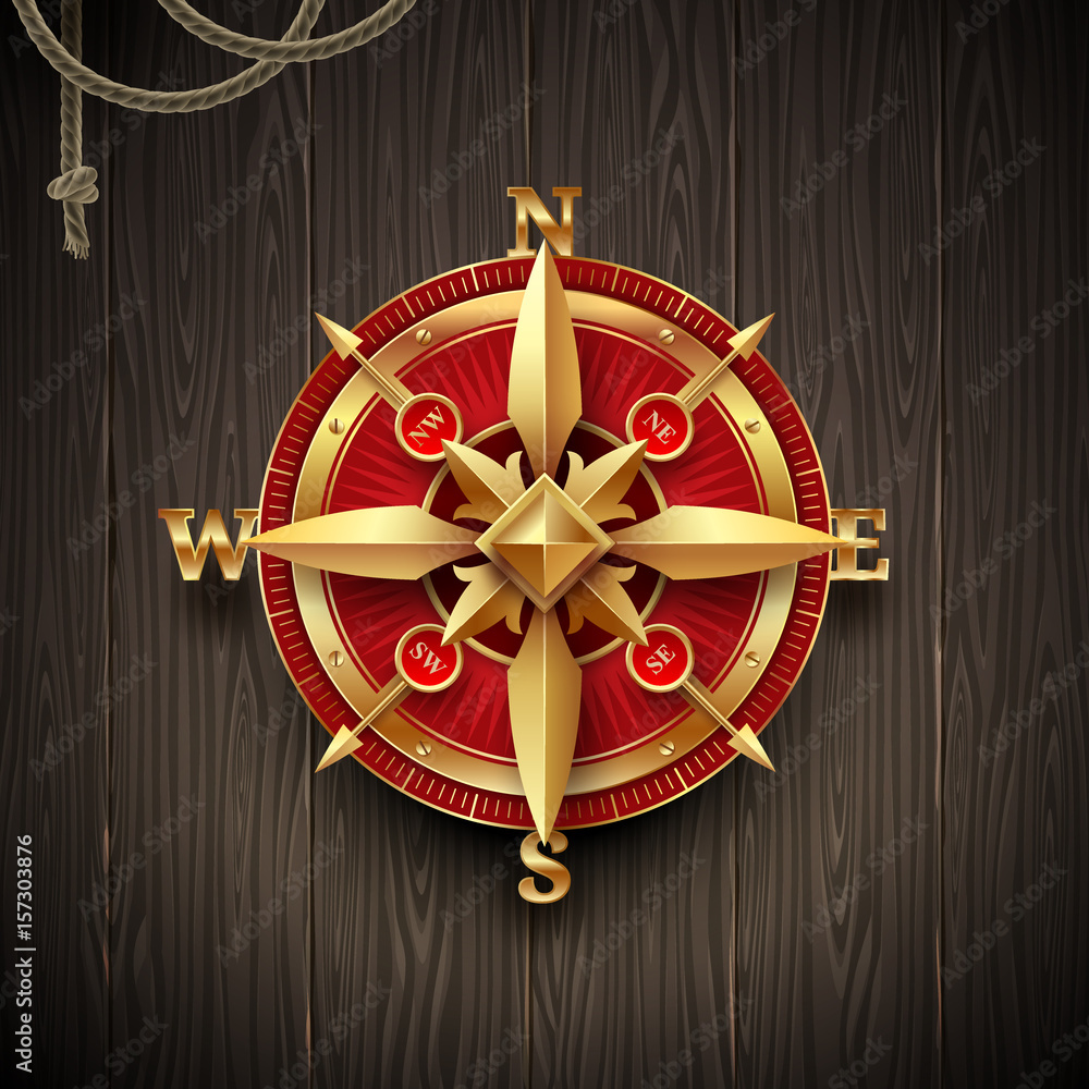 Golden ancient compass rose on a wooden plank background. Vector ...