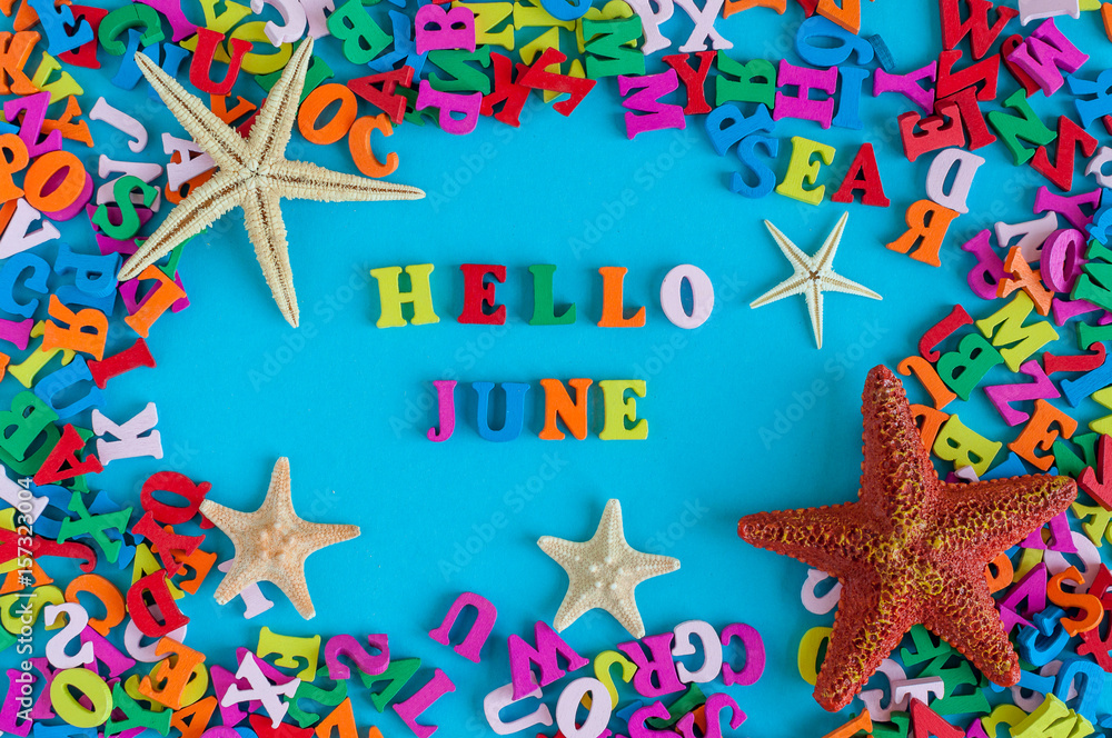 Hello June - word composed of small colored letters at blue background ...
