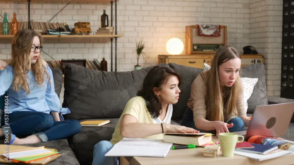 young female student becomes nervous and upset, because computer laptop ...