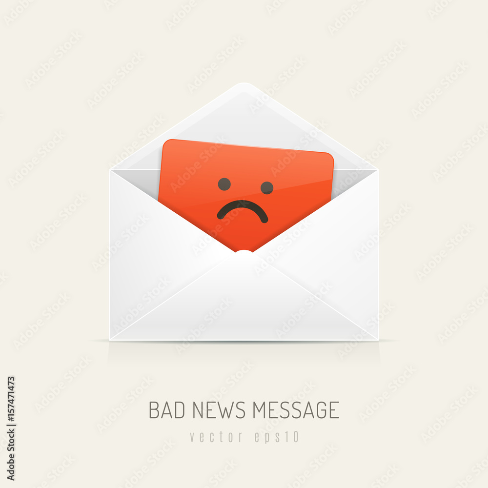 Envelope with orange card which has sad smiley face emoticon printed ...