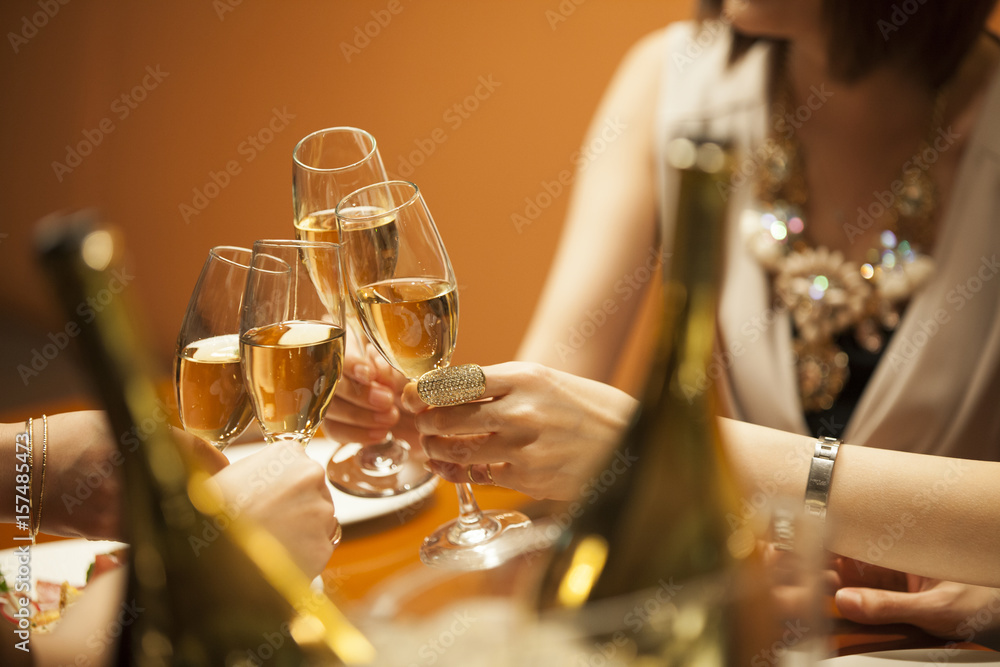 The women are drinking with a champagne at a luxurious restaurant Stock ...