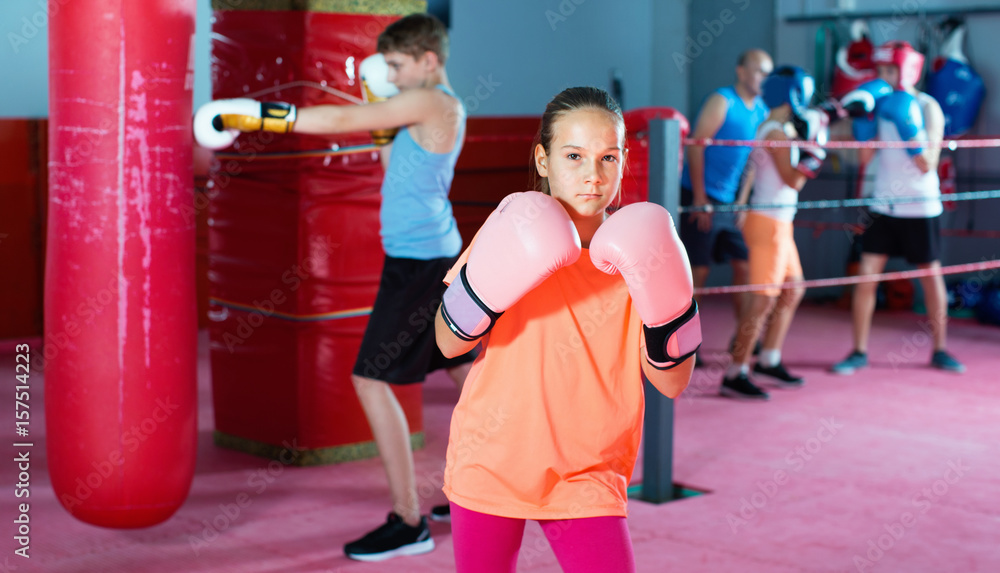 Girl in gloves posing during boxing training at gym Stock Photo | Adobe ...