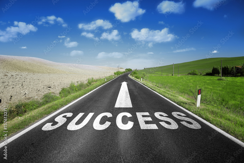 Country asphalt road going straight with success text message and arrow ...